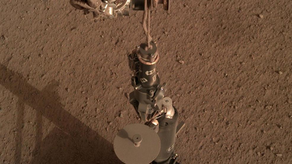 Mars lander starts digging on red planet, hits snags